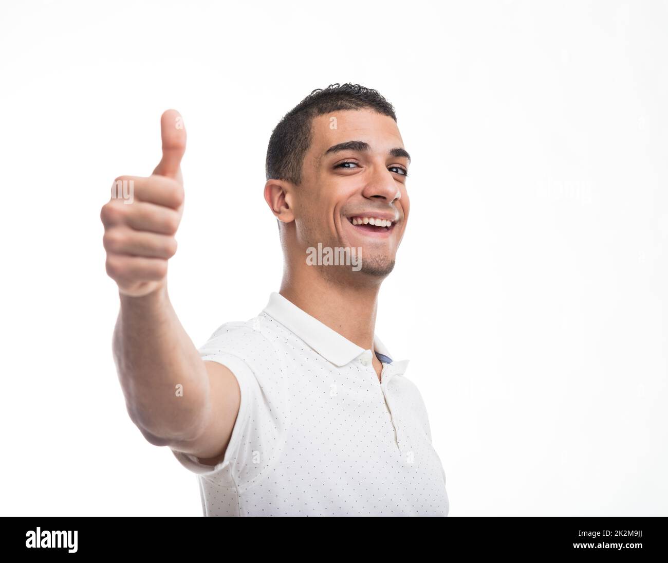 Young smiling man showing thumb hi-res stock photography and images - Alamy