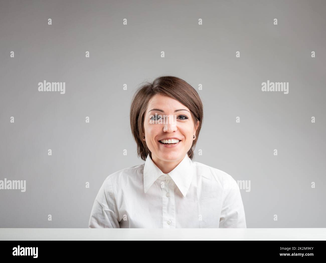 Happy friendly woman with a lovely smile Stock Photo - Alamy