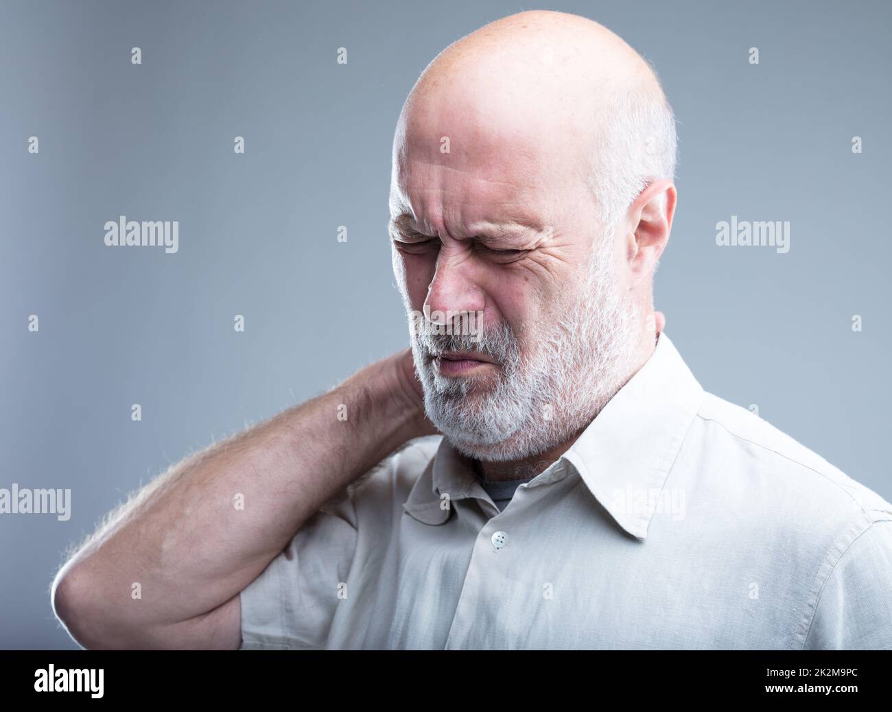 old man having pain in the neck Stock Photo - Alamy