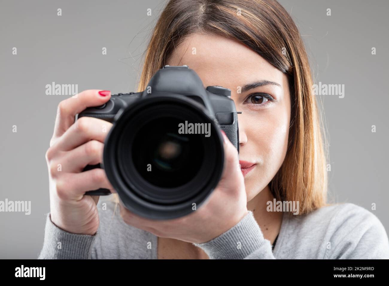 woman with DSLR taking a photograph Stock Photo - Alamy