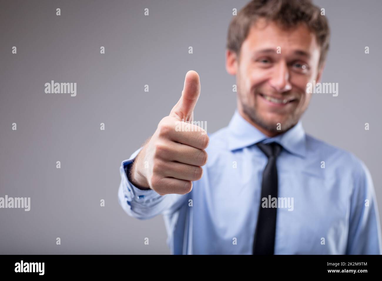 Thumbs up smiling guy hi-res stock photography and images - Alamy
