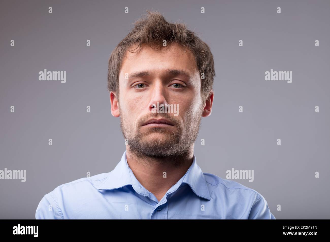 Serious intense young blond man Stock Photo - Alamy