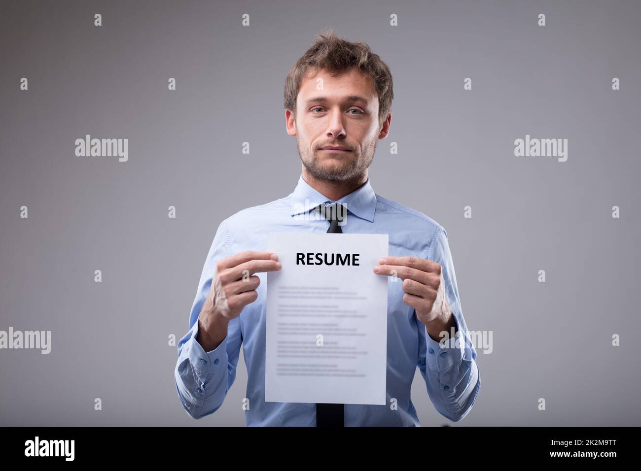 Potential male job applicant holding up his CV Stock Photo - Alamy Potential male job applicant holding up his CV Stock Photo - Alamy
