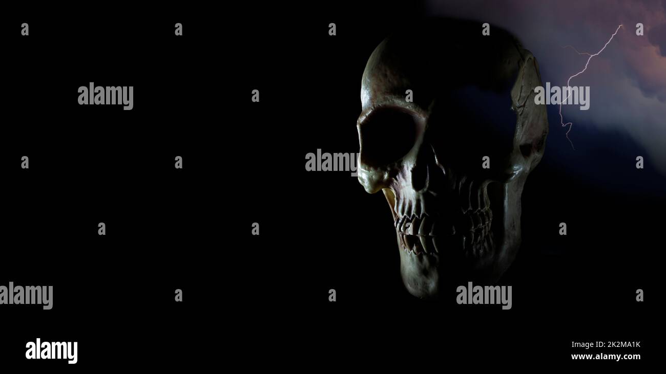 Human skull with rim lighting and lghtning behind Stock Photo - Alamy