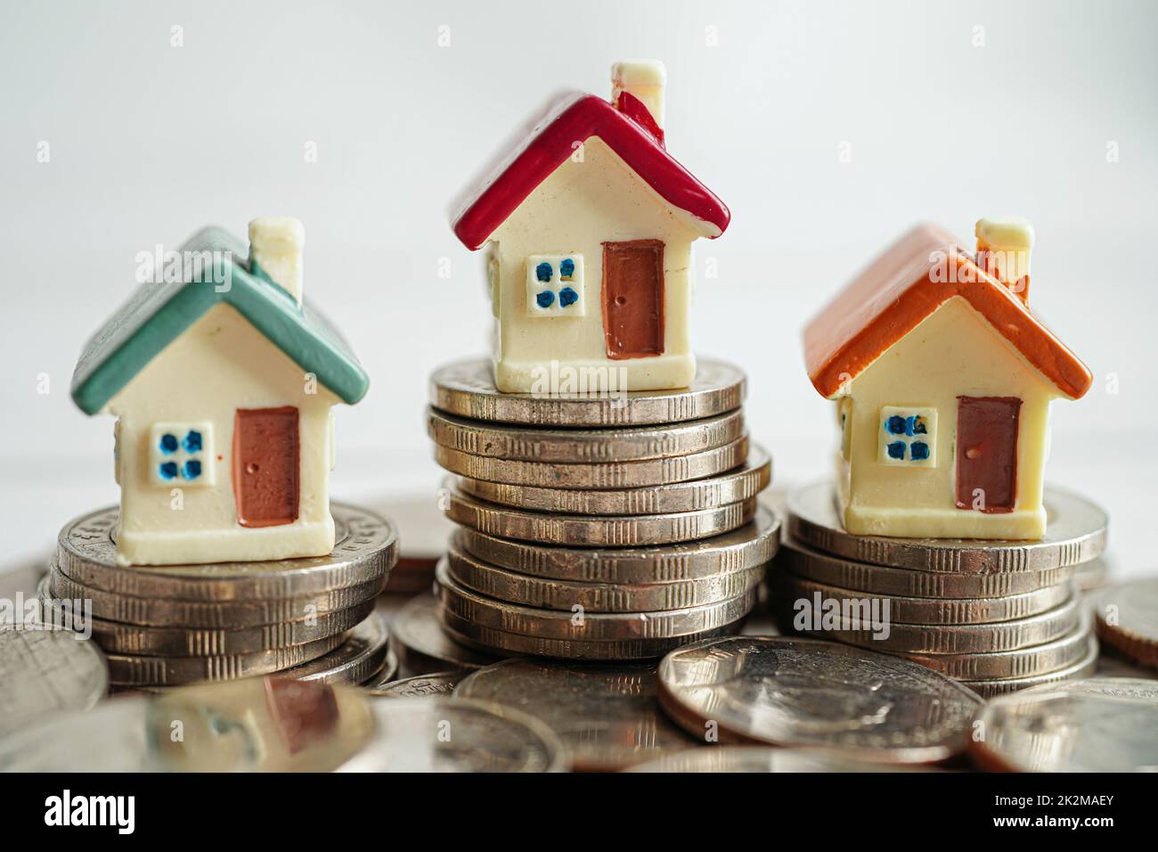 House on stack of coins, Investment property finance concept Stock ...