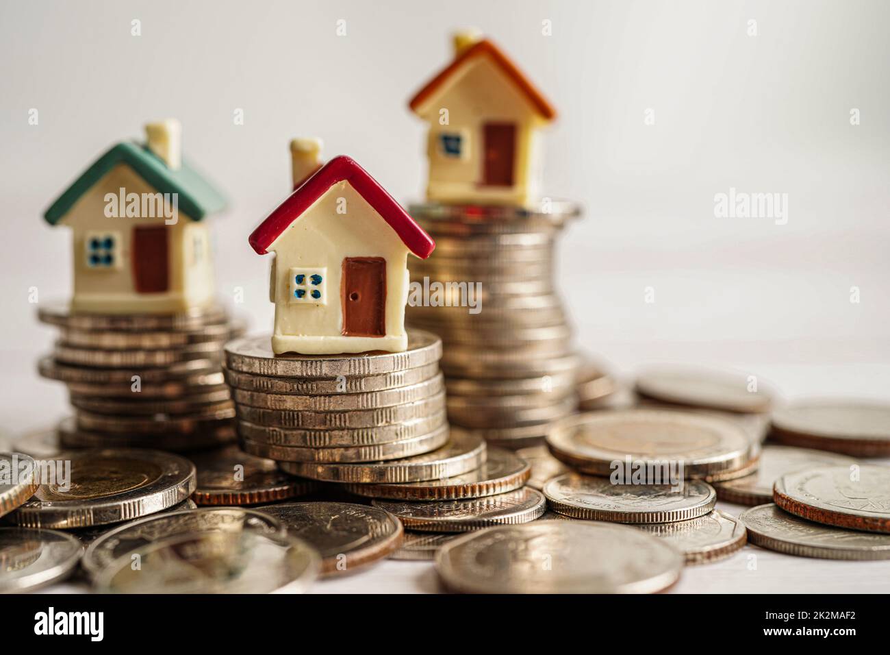 House on stack of coins, Investment property finance concept Stock ...