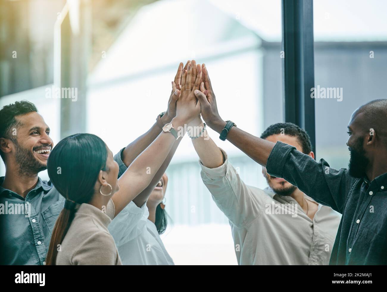 High fiving each other hi-res stock photography and images - Alamy