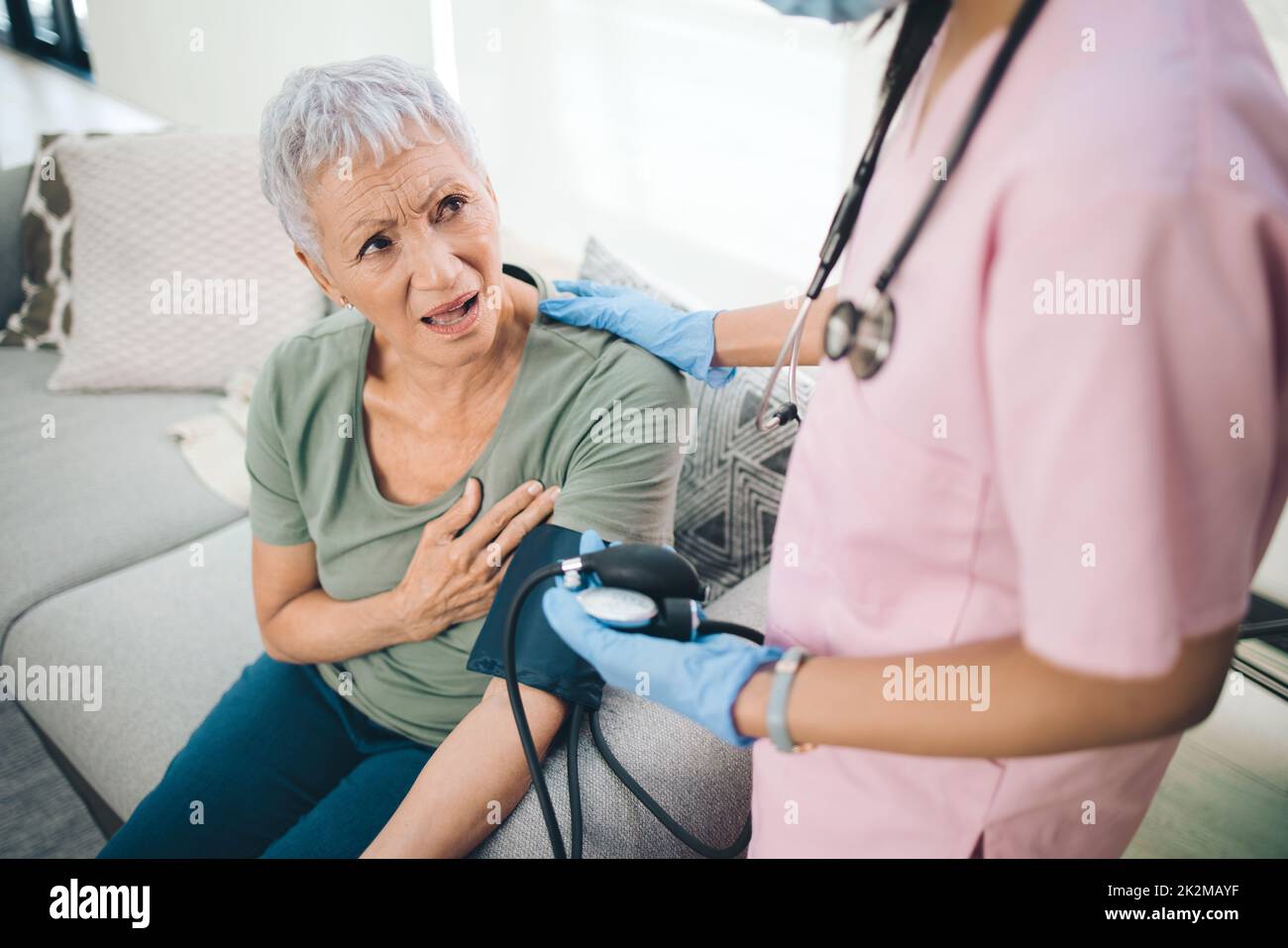 Female doctor checking blood pressure of a patient hi-res stock ...