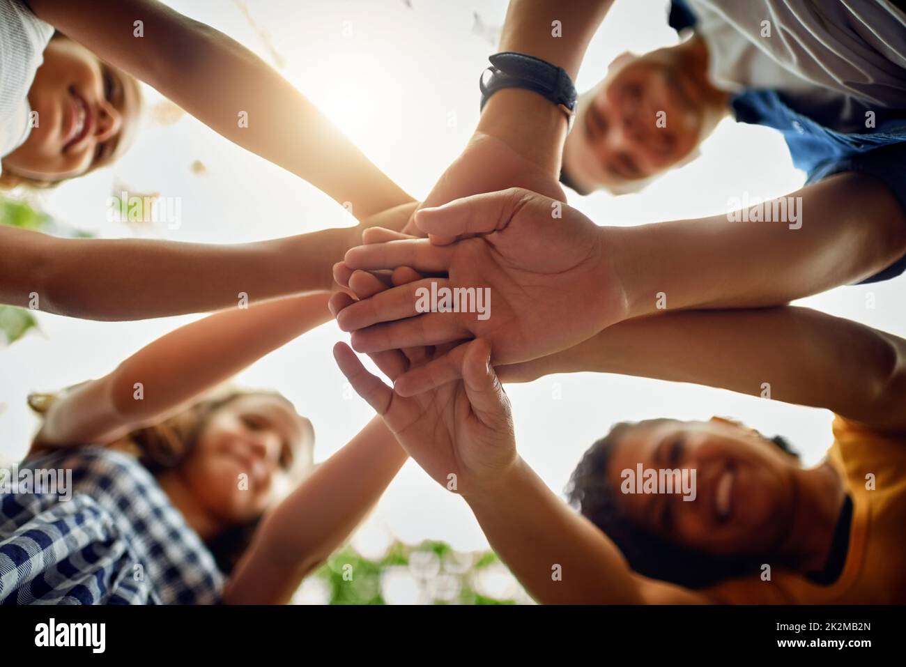 Children joining hands hi-res stock photography and images - Alamy