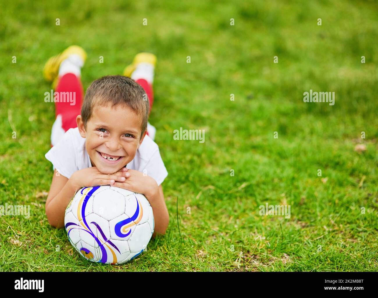 A boy playing football alone hi-res stock photography and images - Alamy