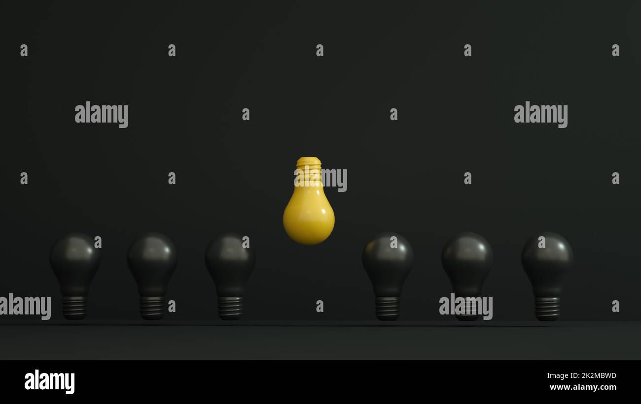 Yellow bulb inverted & higher among black bulbs on dark background ...