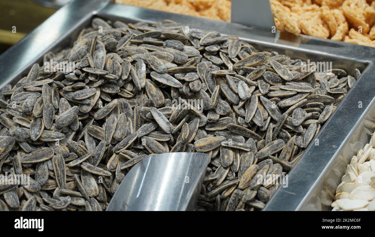 Roasted sunflower seeds for sale in local market Stock Photo - Alamy