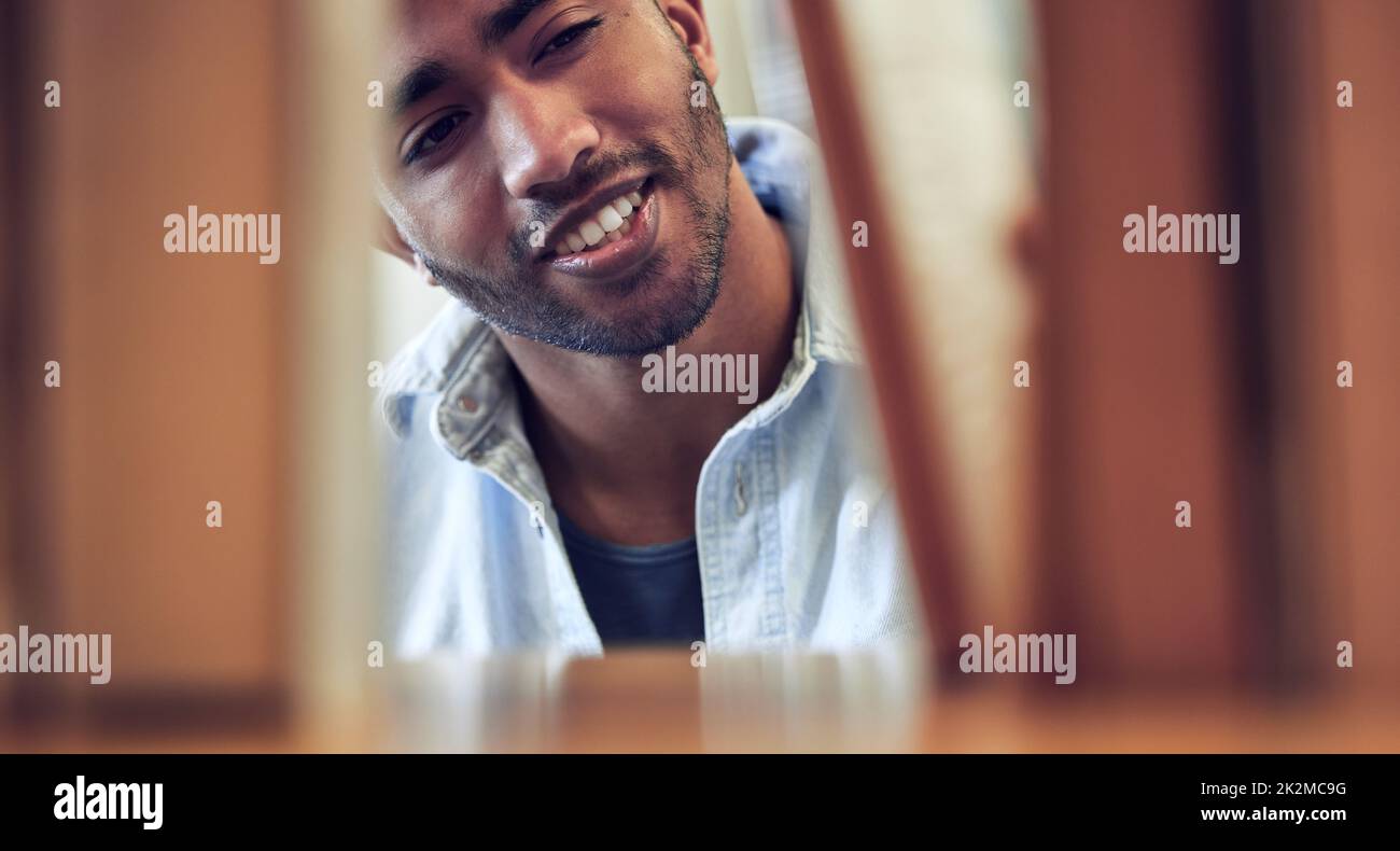 Advance your knowledge, transform your life. Shot of a young man ...