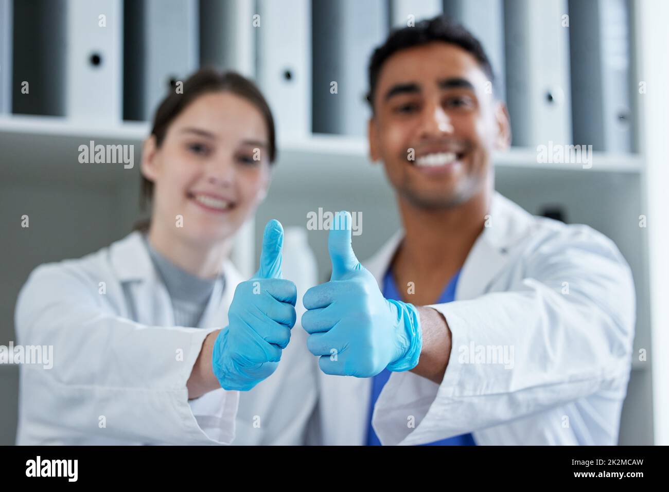 Diverse scientists showing thumbs up hi-res stock photography and ...