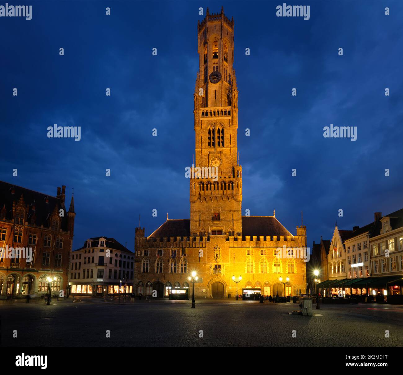 Belfry tower and Grote markt square in Bruges, Belgium on dusk in ...
