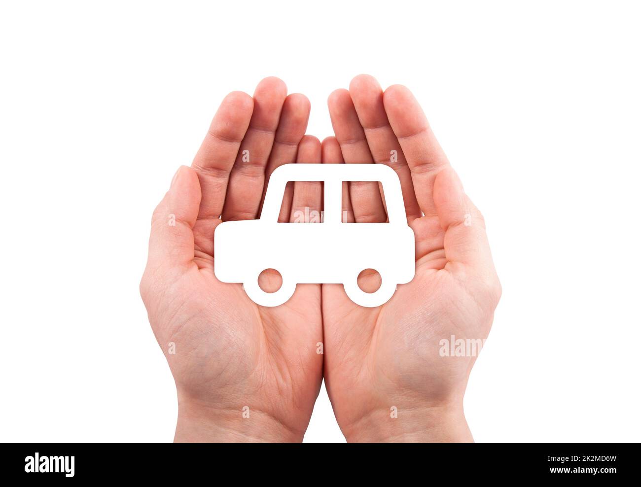 Car protection. Small paper car cutout covered by hands Stock Photo - Alamy