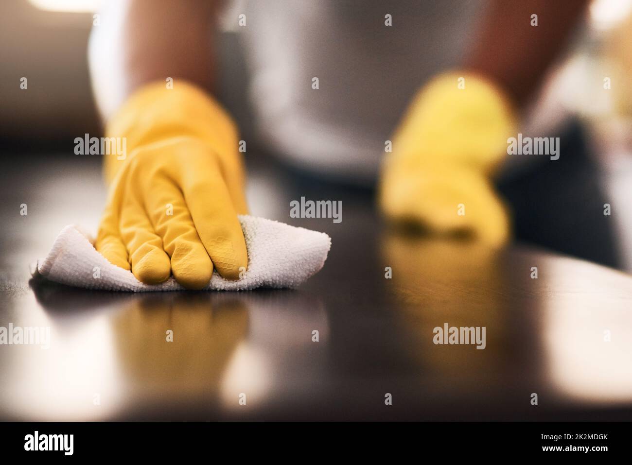 Keeping a germ-free home. Cropped shot of an unrecognizable man ...