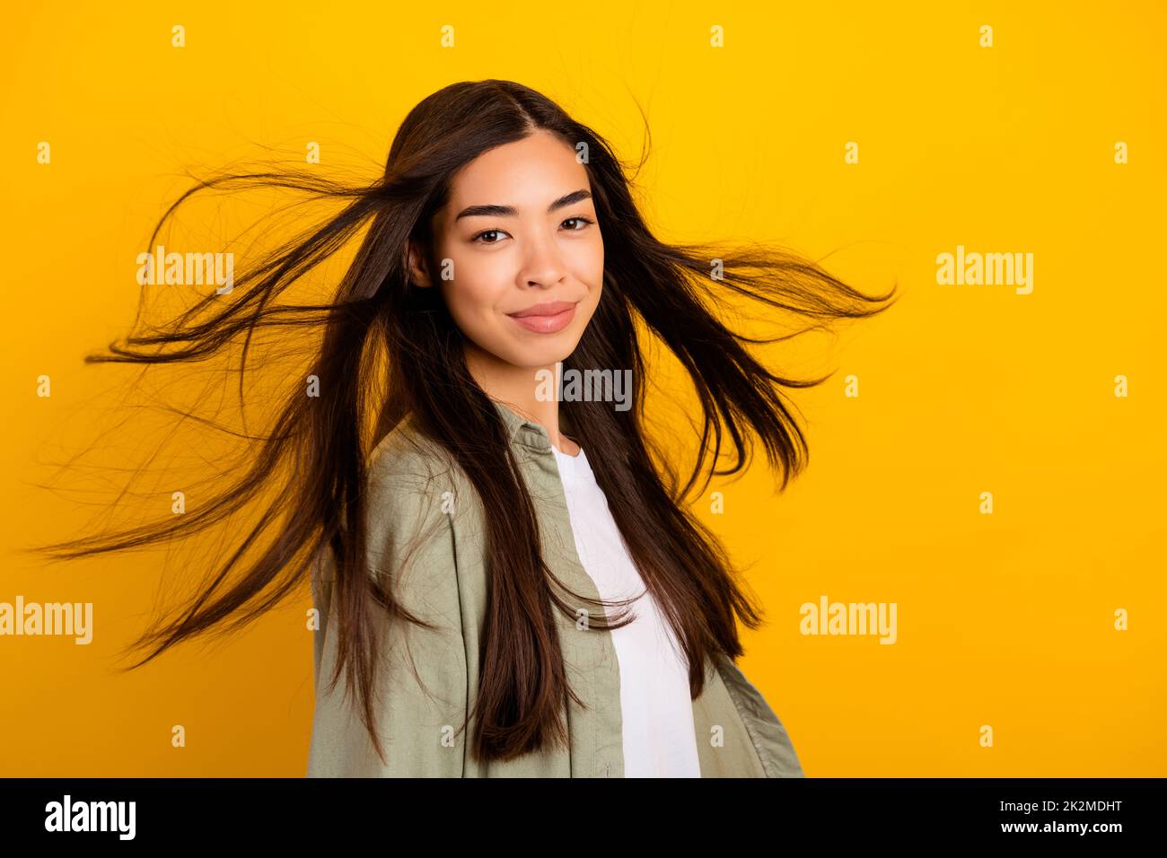 Portrait of charming adorable lady flying hairdo good mood isolated on ...