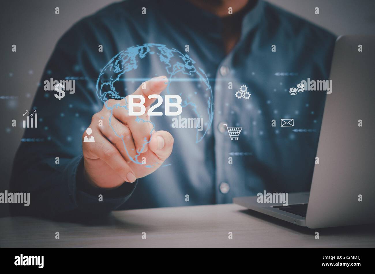 man hand using laptop virtual screen B2B Business to Business icons and symbols. Business ...