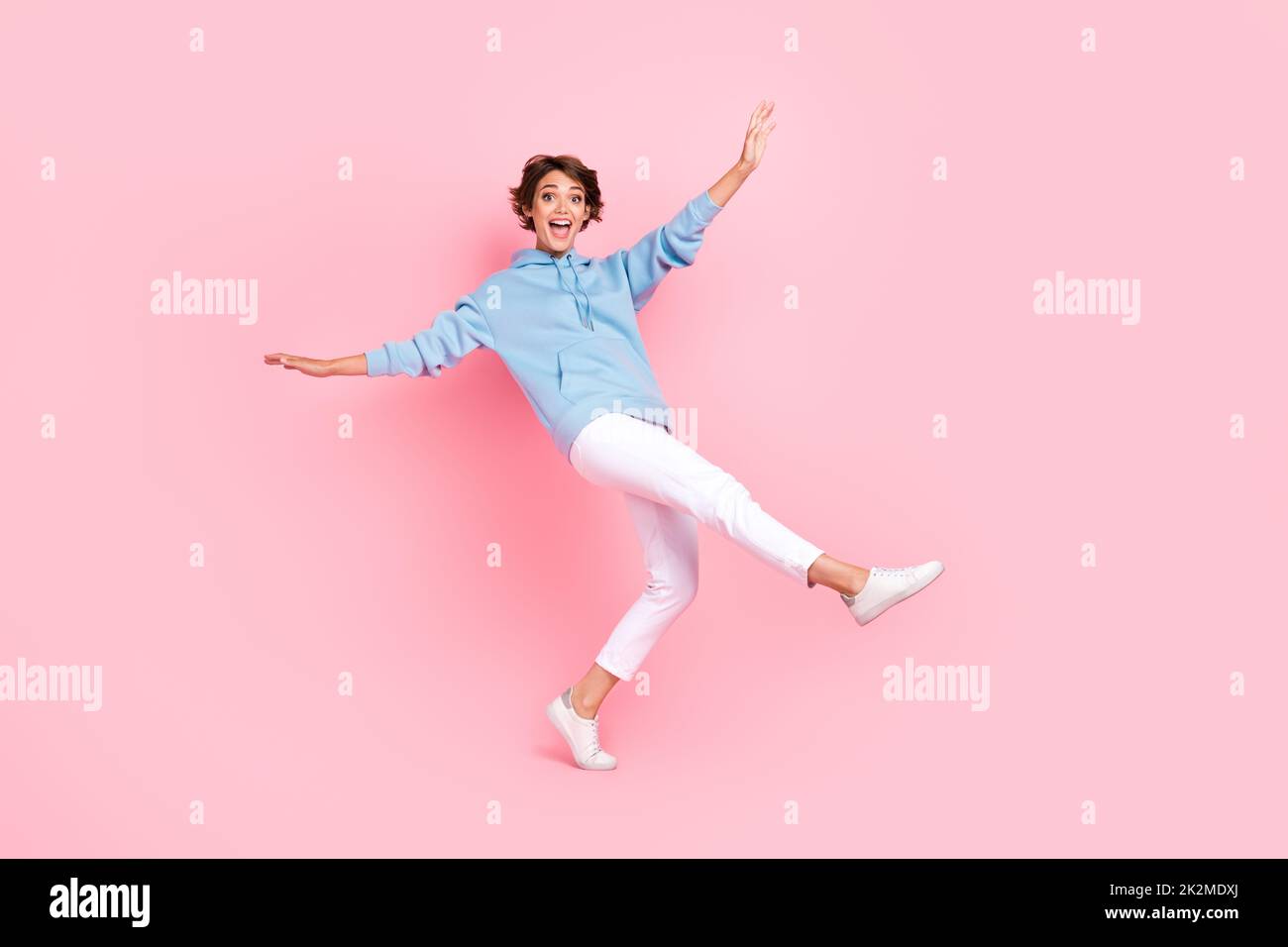 Full body photo of overjoyed lady tendy clothes stand one leg toes good ...