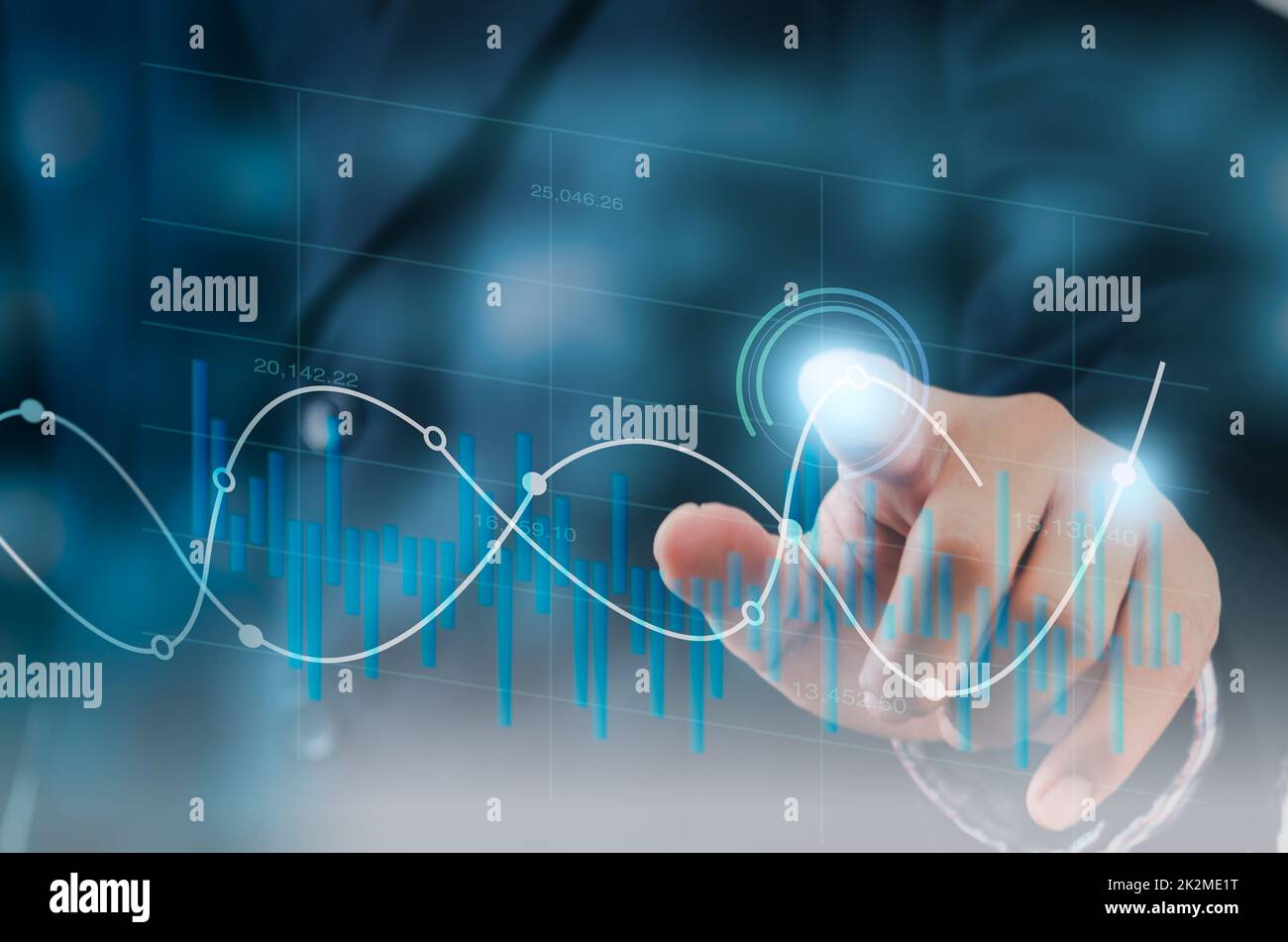 Businessman finger touching Virtual screen with stock market changes. business candlestick chart ...