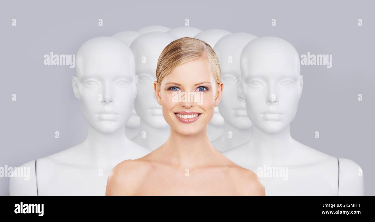 Bring your beauty to life. A young woman standing amongst a group of ...