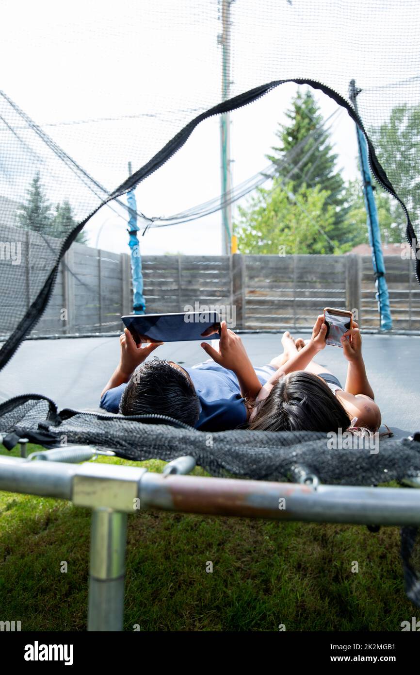 Boy preteen trampoline hi-res stock photography and images - Alamy