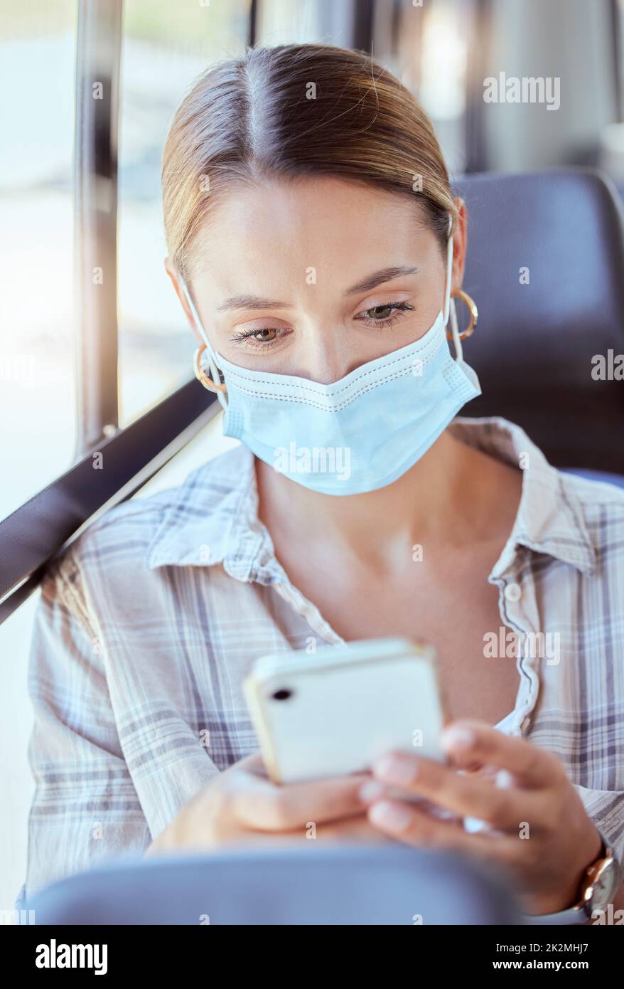 Smartphone, public transport and woman with covid face mask reading online safety compliance ...