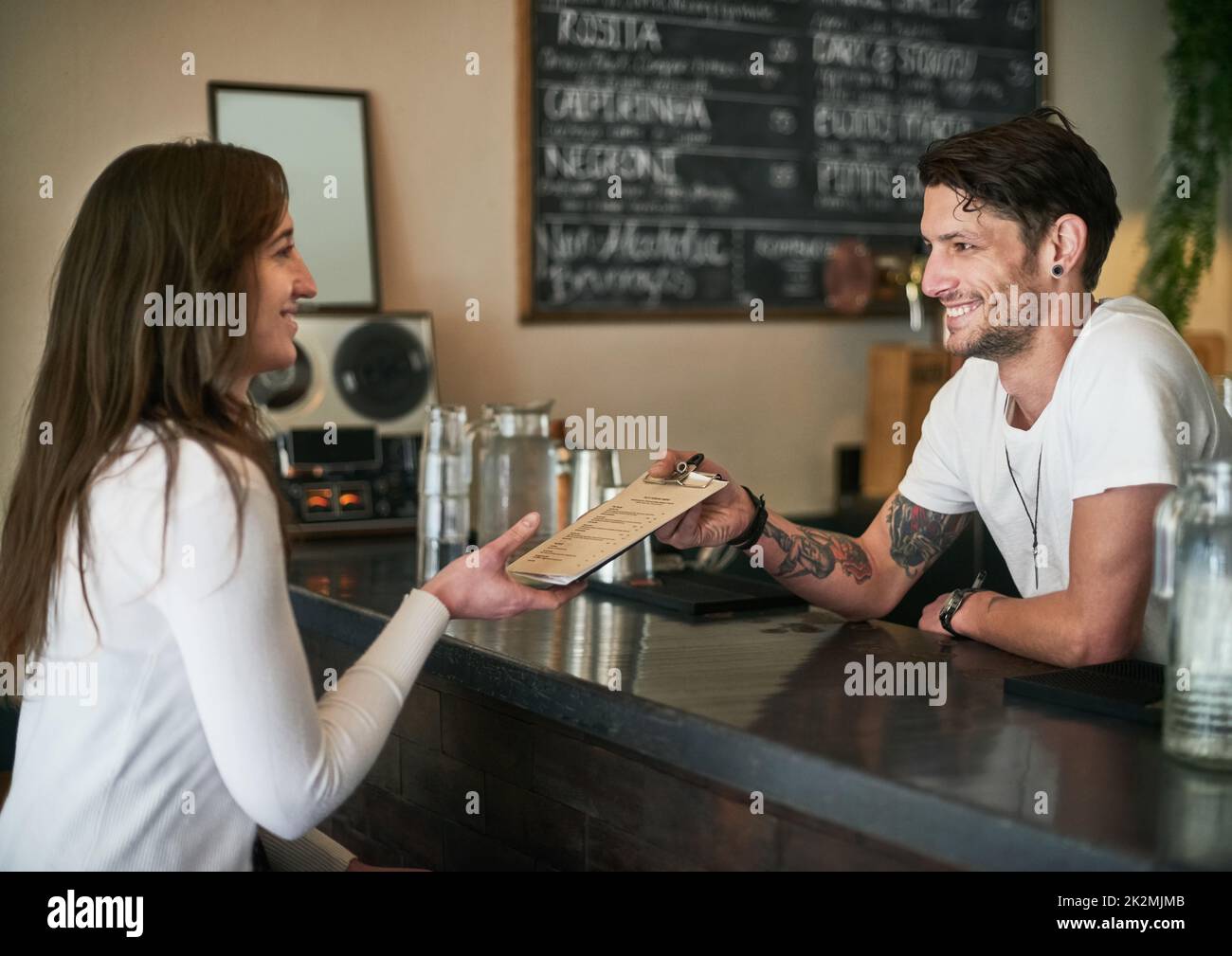 Young men at bar counter hi-res stock photography and images - Alamy