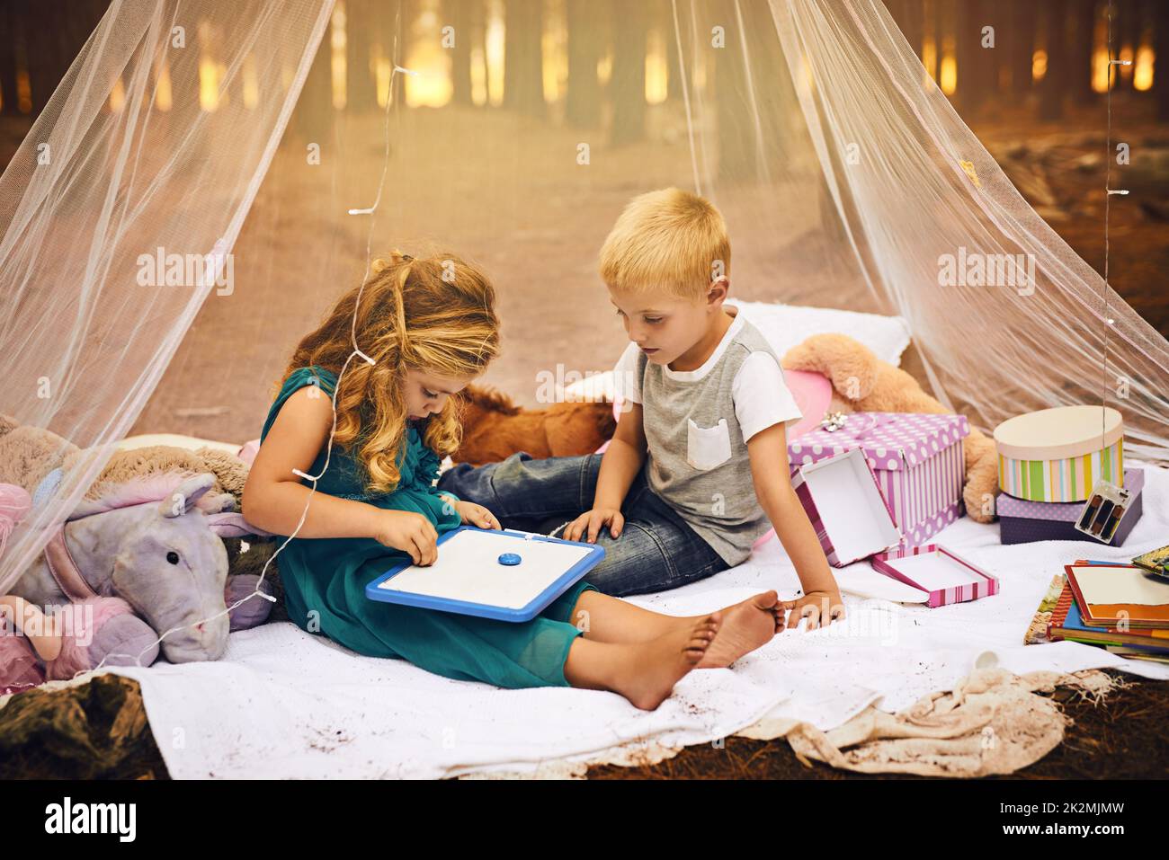 This looks simple enough. Shot of a happy little boy and girl drawing ...