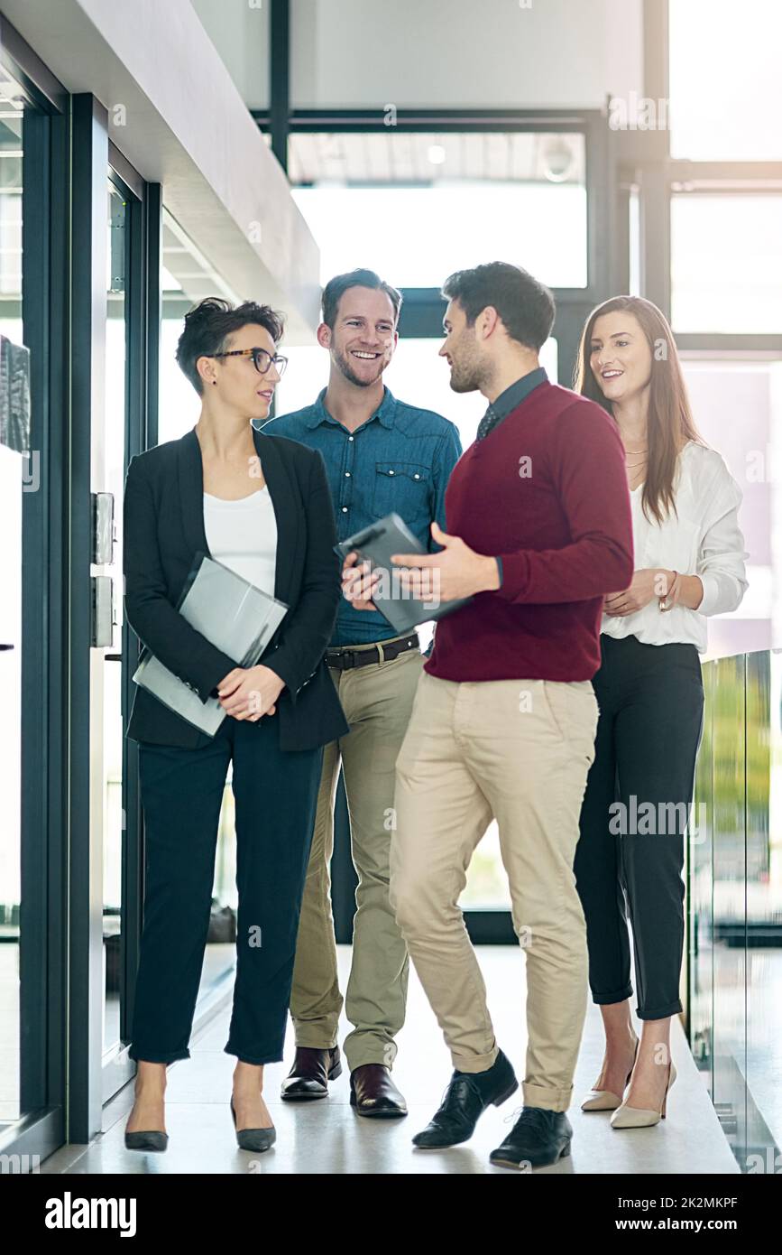 Together they make a great team. Shot of a group of colleagues talking ...