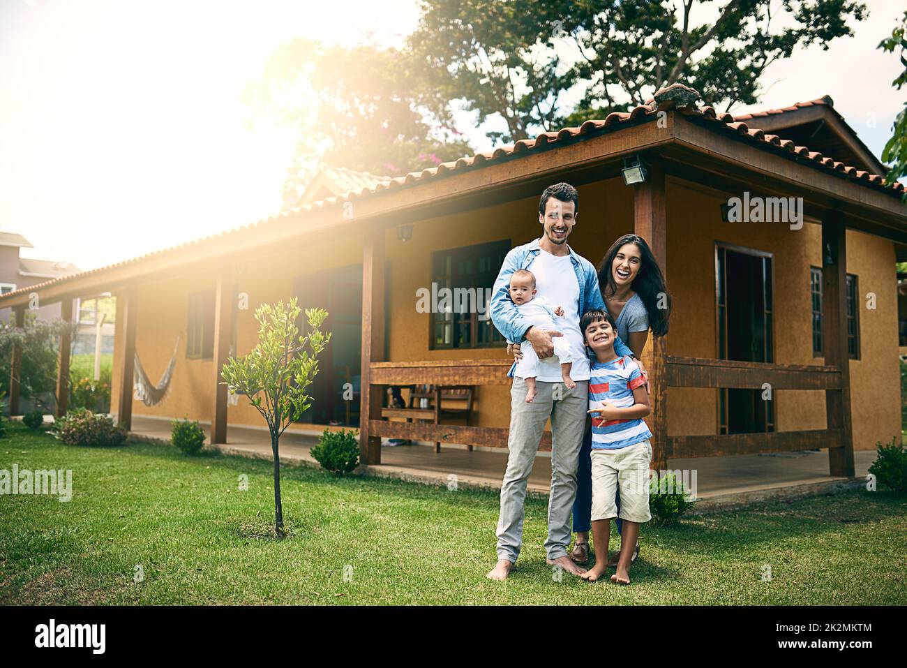 We are a happy family. Full length portrait of a happy young family of ...