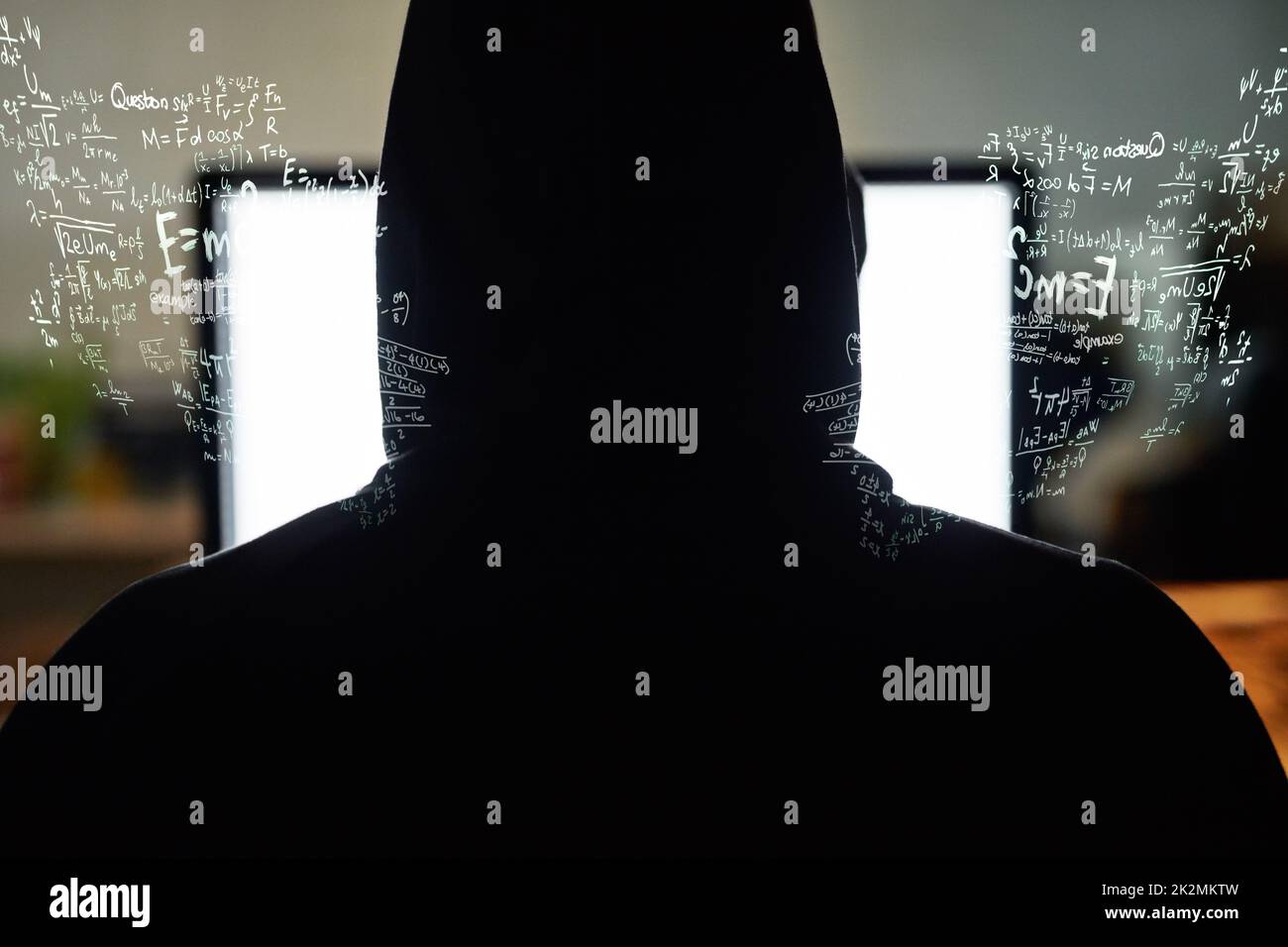 Unravelling The Code Rearview Shot Of An Unidentifiable Hacker Cracking A Computer Code In The