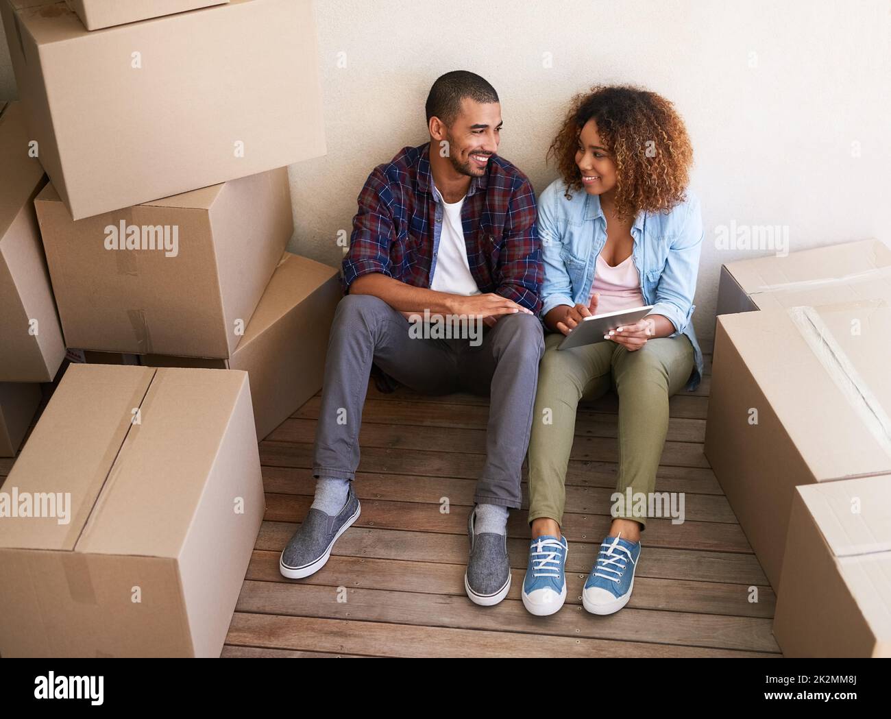 Sitting man sitting on boxes hi-res stock photography and images - Alamy