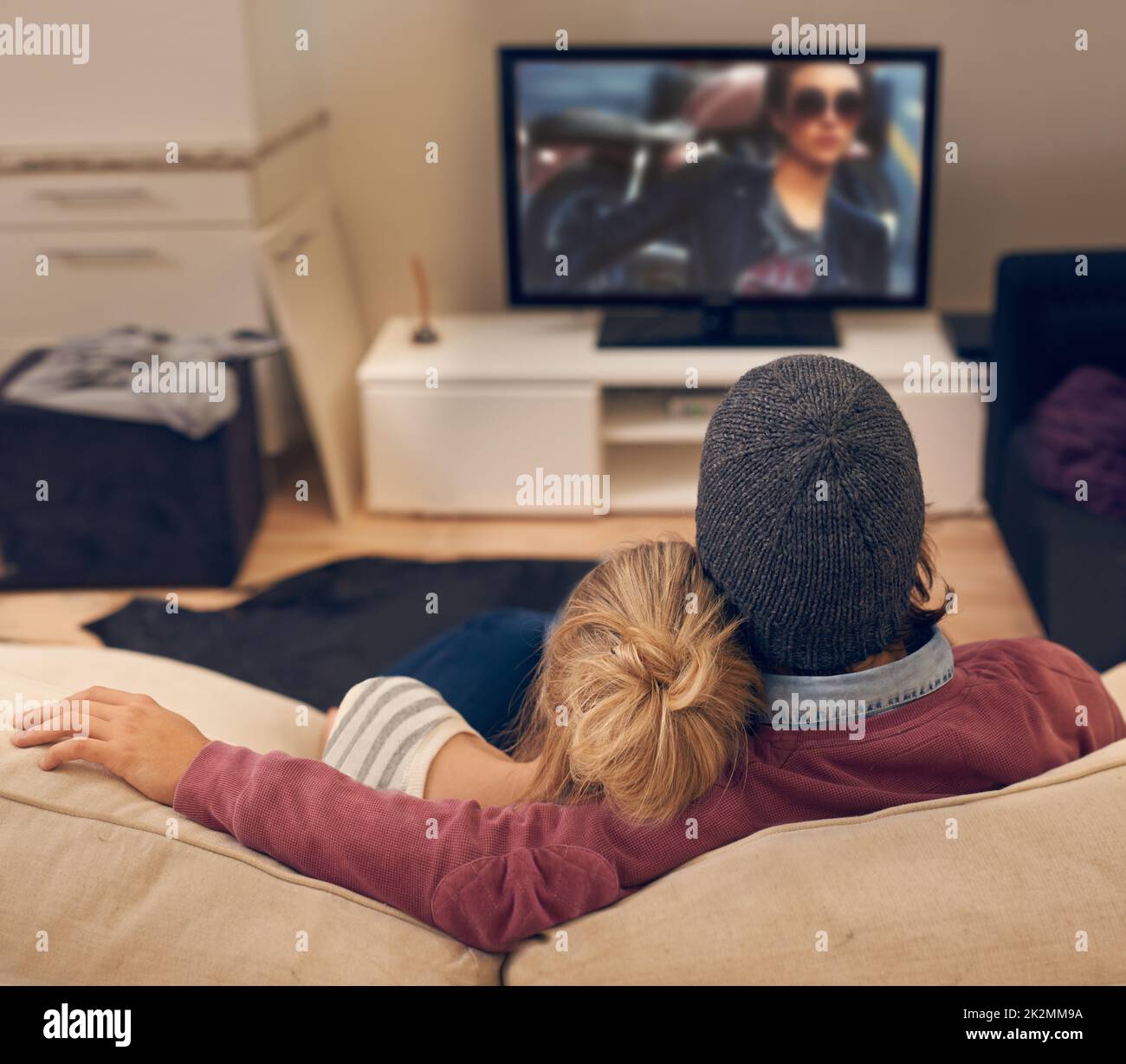 Black Couple Cuddling Watching Tv