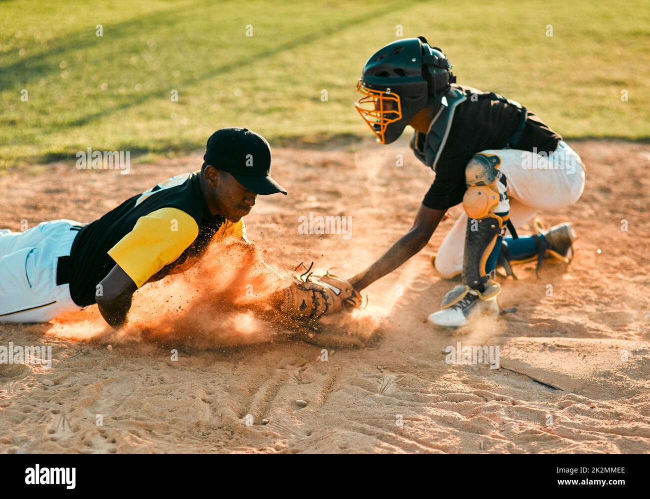 Sliding his way to victory. Shot of a baseball player sliding to the ...