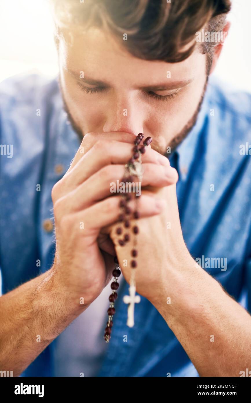 Young man praying thinking hi-res stock photography and images - Alamy