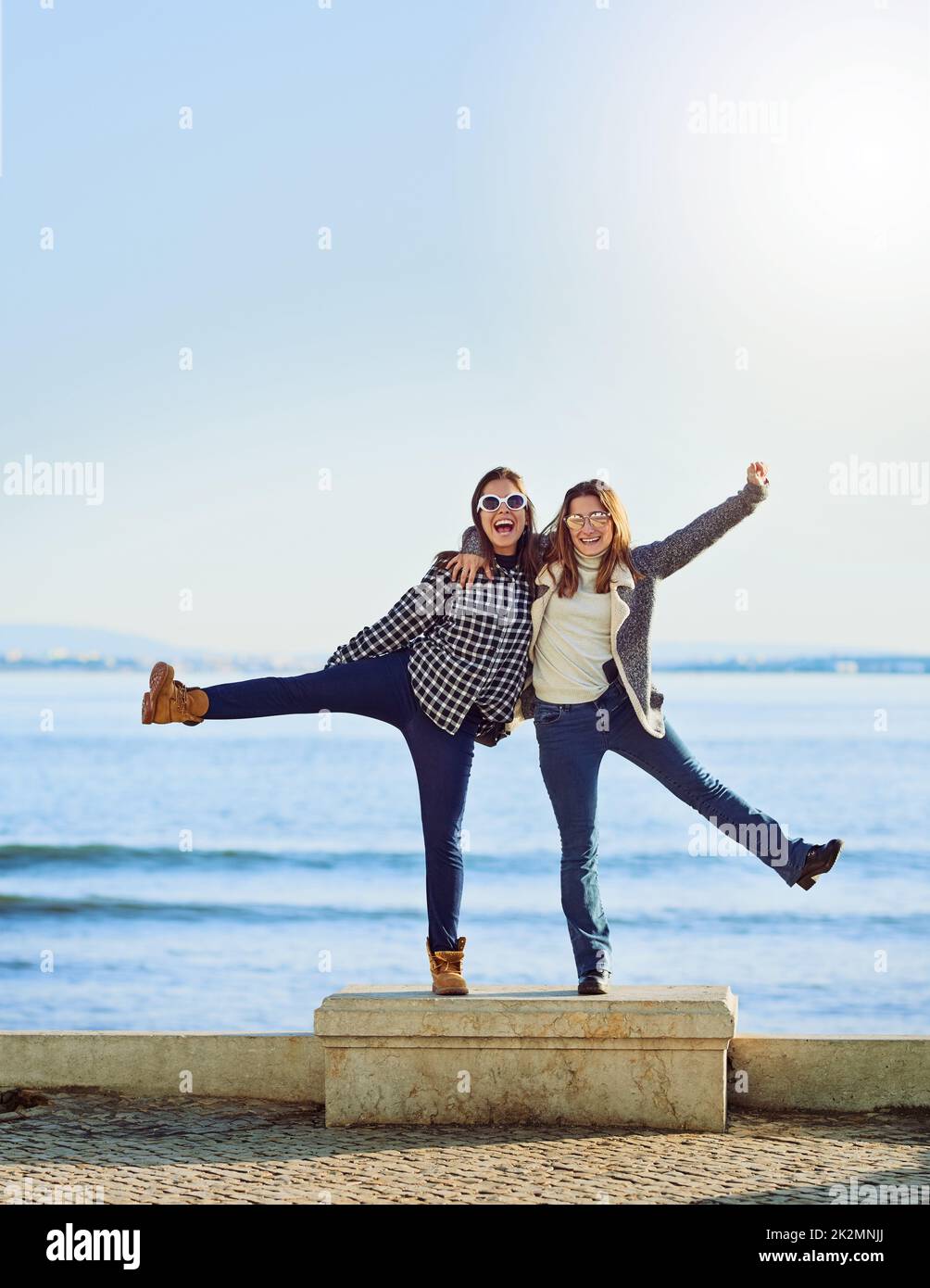 The Sea And My Bestie Full Length Portrait Of Two Attractive Young Women Spending A Day By The