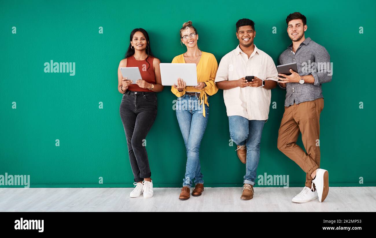 Were always in the loop. Portrait of a group of young designers using ...