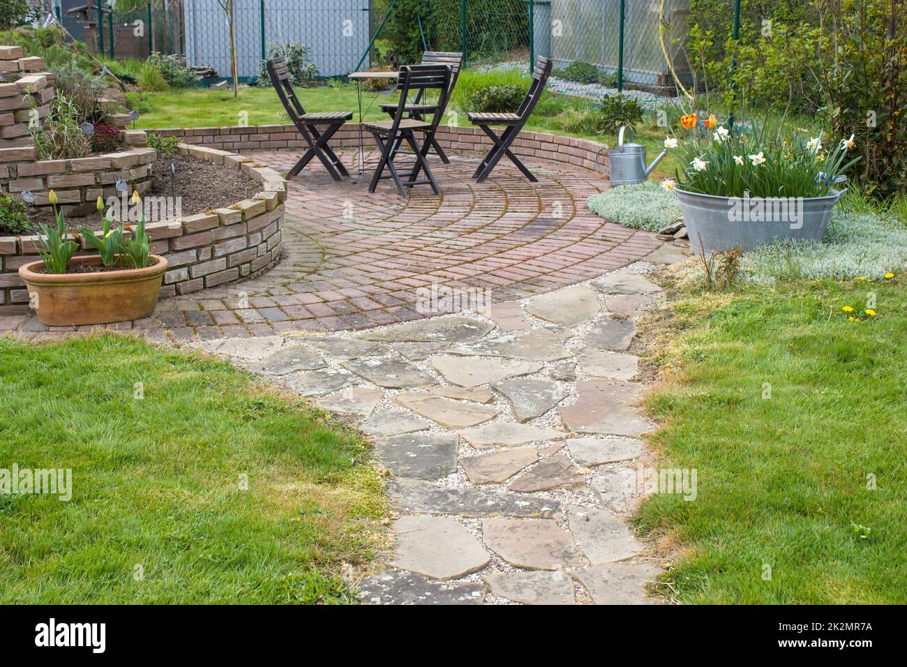 rustic garden - blooming spring flowers Stock Photo - Alamy