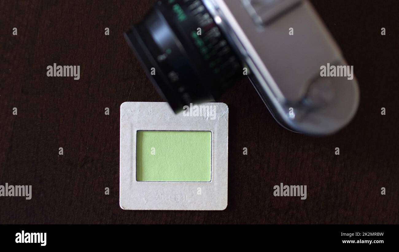 Vintage film camera and slide film Stock Photo - Alamy