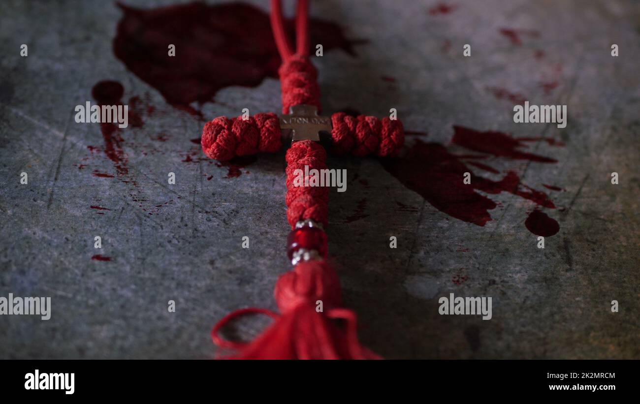 Close up of cross of jesus on bloody background Stock Photo - Alamy