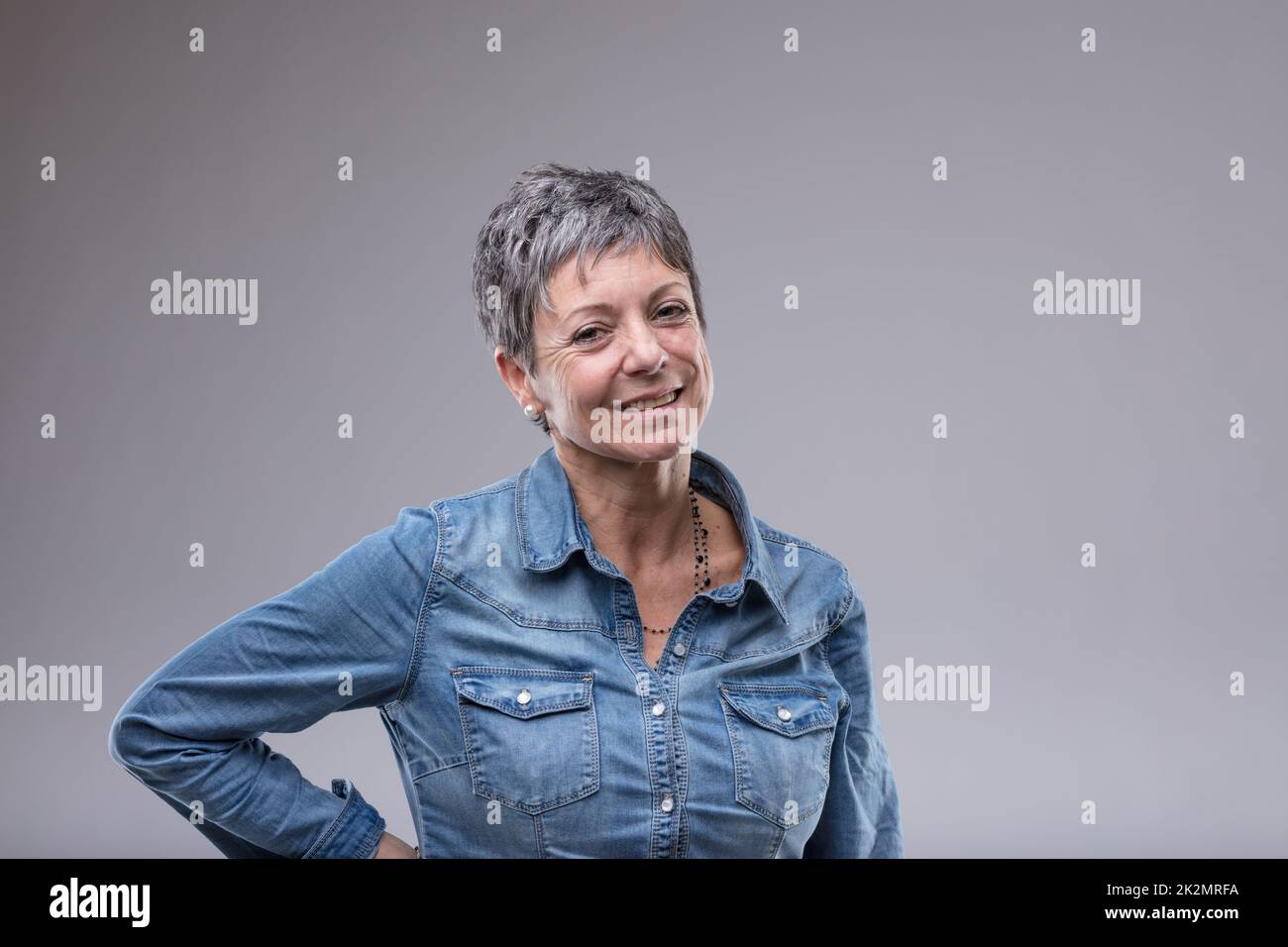 Attractive older woman with a friendly smile Stock Photo - Alamy