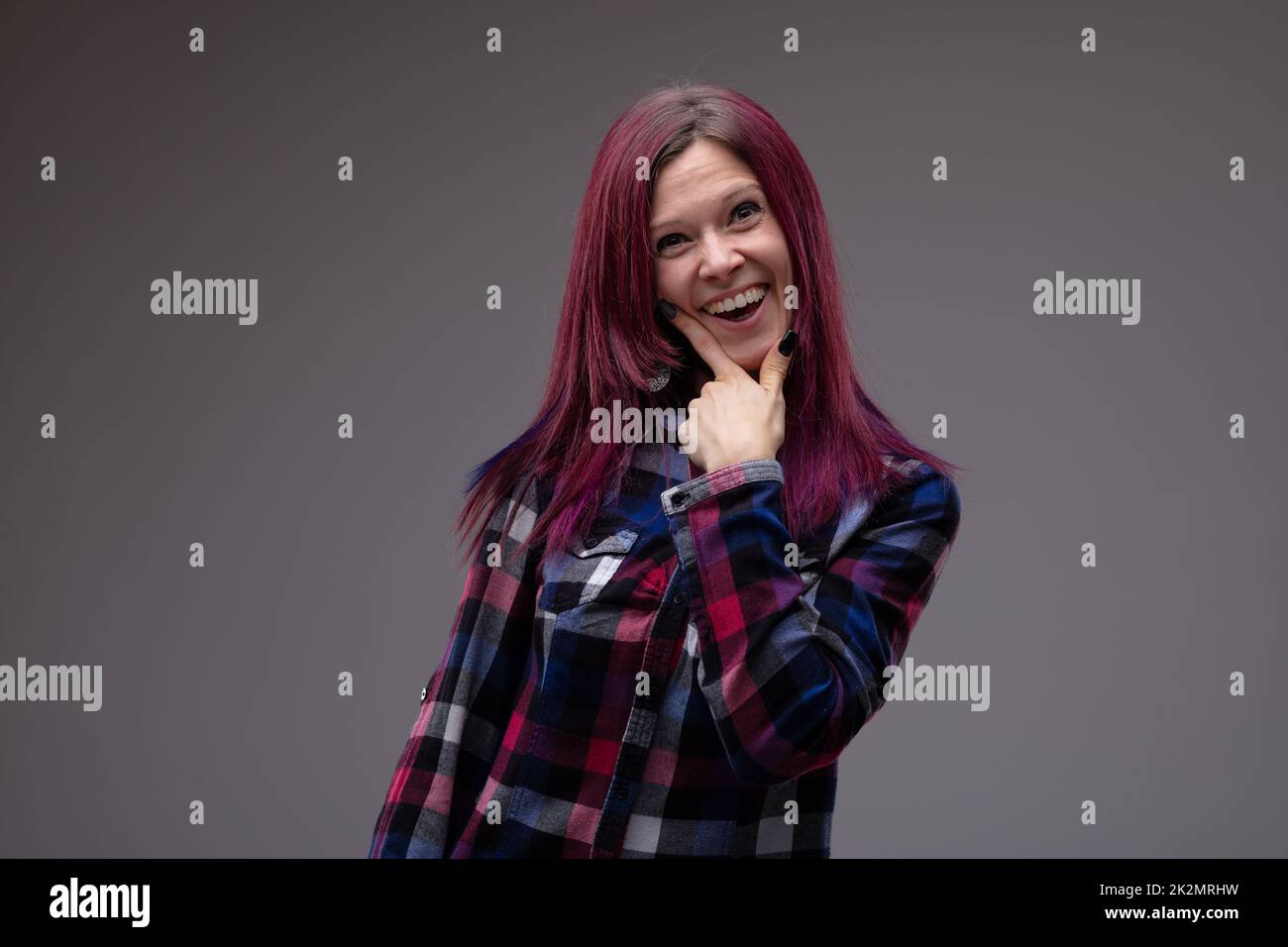 Fun playful attractive woman laughing at camera Stock Photo - Alamy