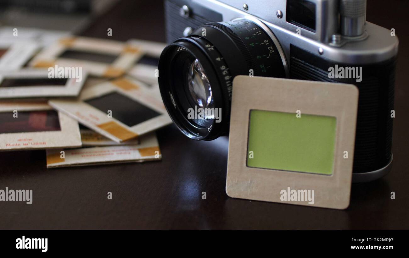 Close up of vintage film camera and slide films Stock Photo - Alamy