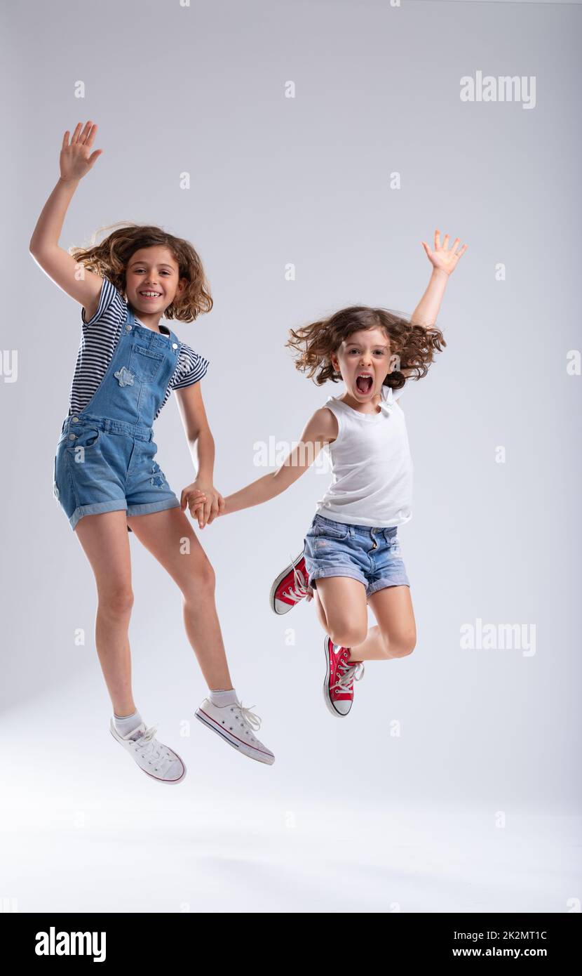 Kids jumping for joy hi-res stock photography and images - Alamy