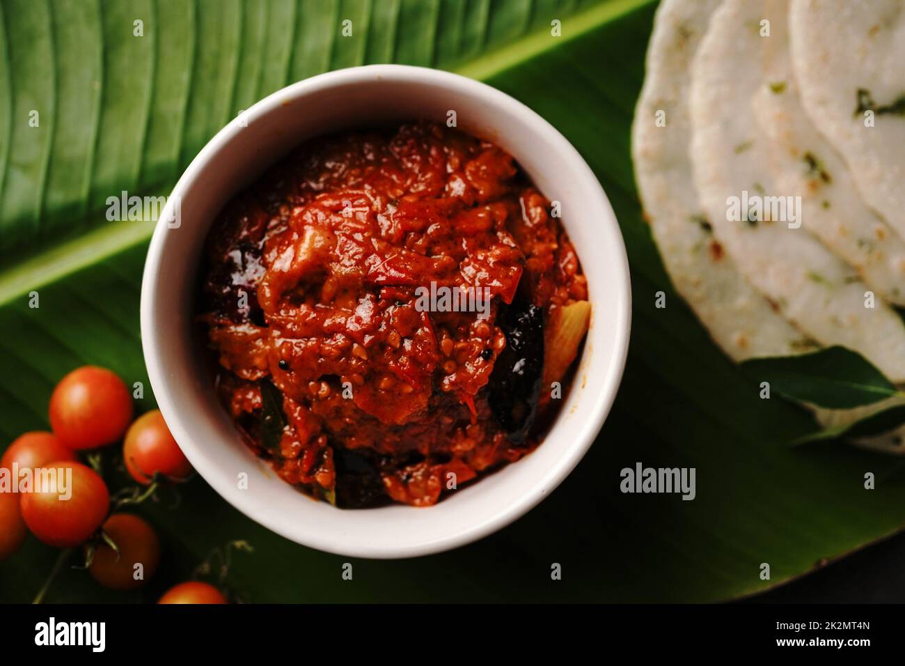 Homemade Tomato pickle Thokku or Chutney served with rice dosa- South ...