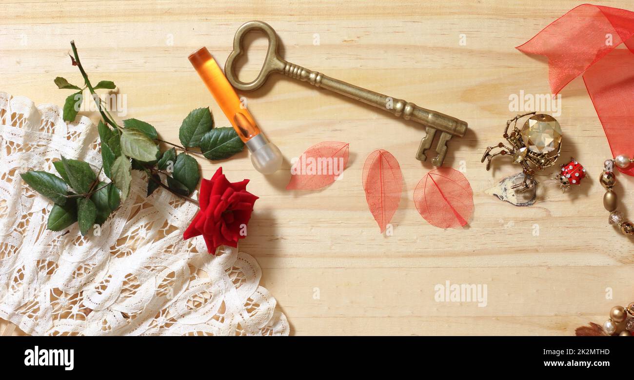 Vintage Brass Key With Lace Fan and Red Rose Stock Photo - Alamy