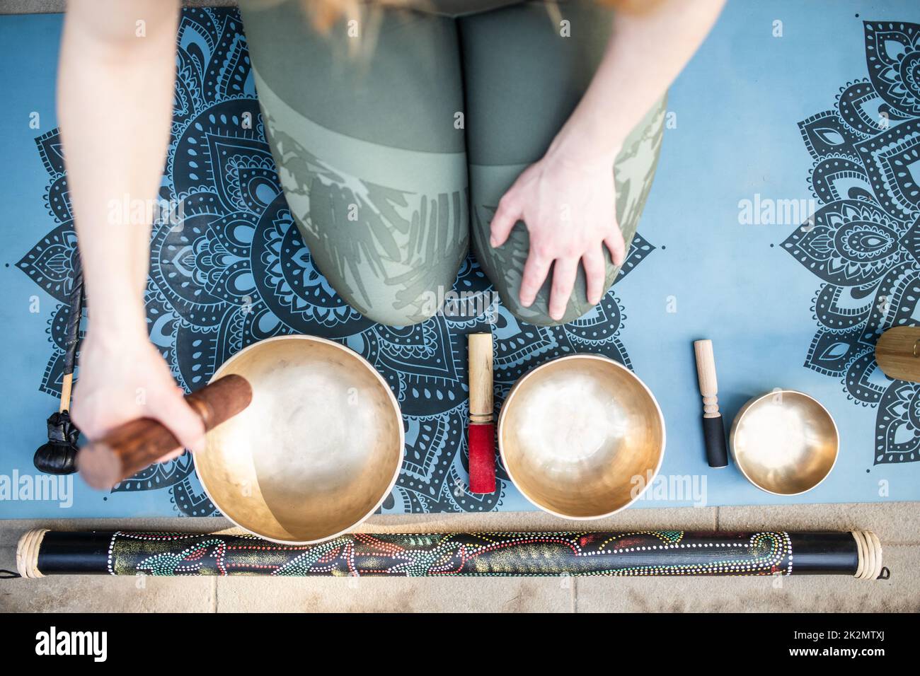 Yoga concept, meditation and sound therapy. Beautiful young caucasian ...