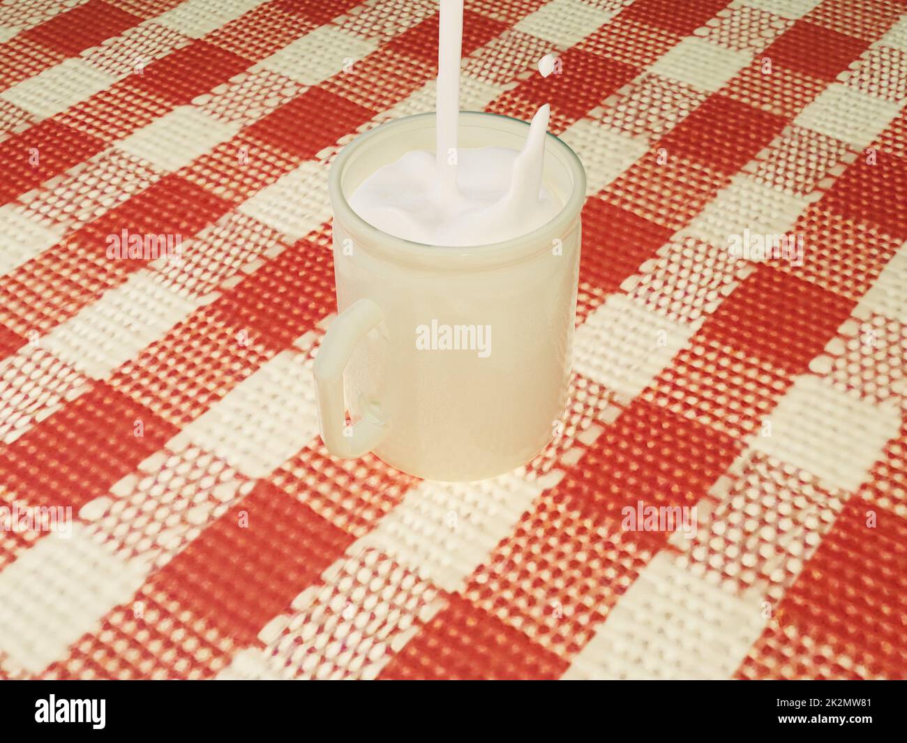 Milk pouring in a cup Stock Photo - Alamy